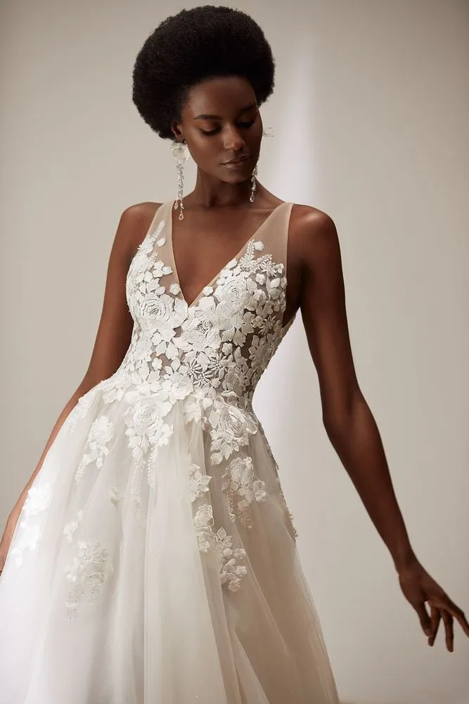 Gabi - A-line wedding dress features a long train and a sparkly corset ...